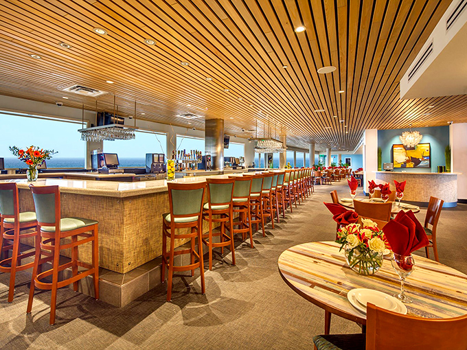 The warm wood-slatted ceiling and elegant bar create the perfect indoor retreat when you need a break from that relentless Florida sunshine.