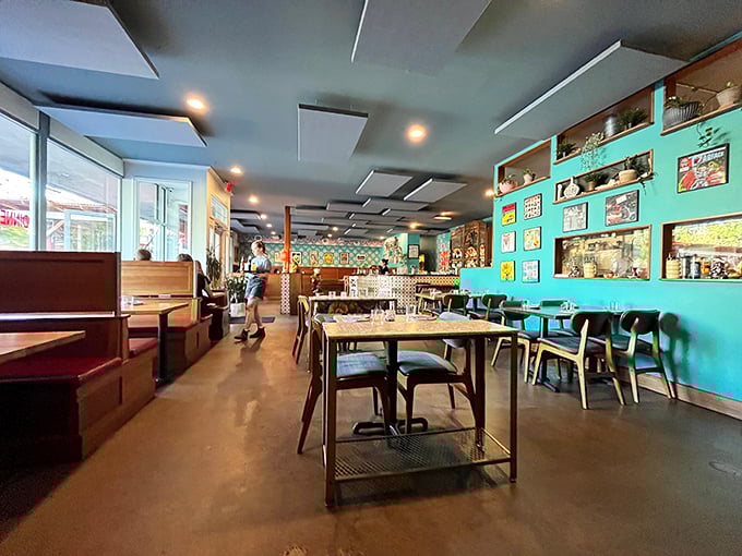 Turquoise walls and thoughtful design create an atmosphere that's both exotic and welcoming—like stepping into a stylish friend's home in Jakarta.