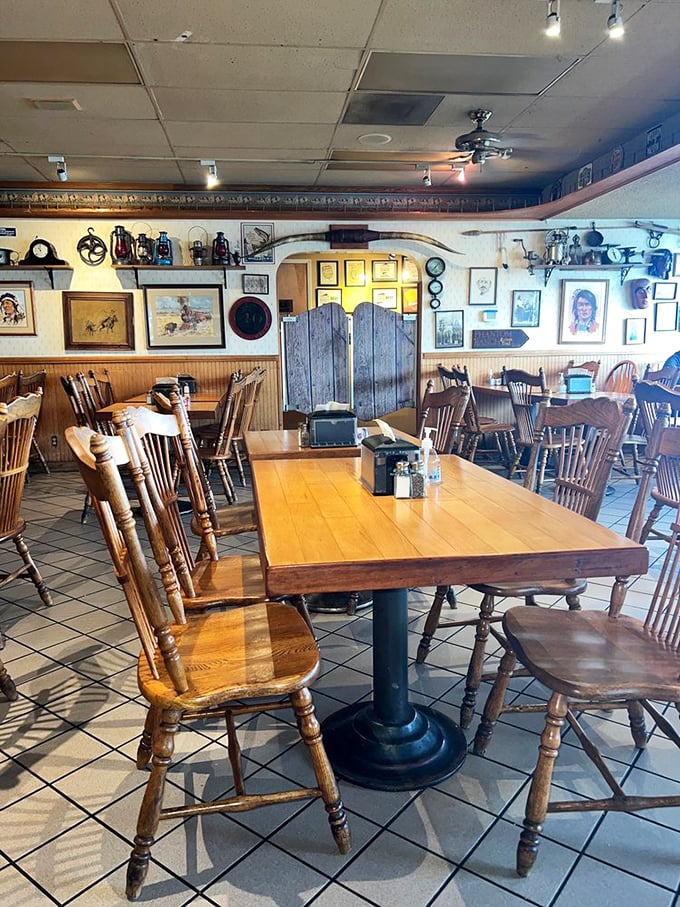 Wooden chairs, Western decor, and walls filled with memories—Sam's dining room feels like the living room of your favorite barbecue-obsessed uncle.