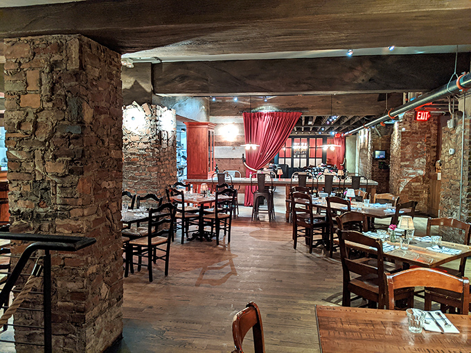 Stone walls and wooden beams create a rustic Italian hideaway beneath Cincinnati's streets. Like dining in your Italian grandmother's wine cellar—if she had impeccable taste.