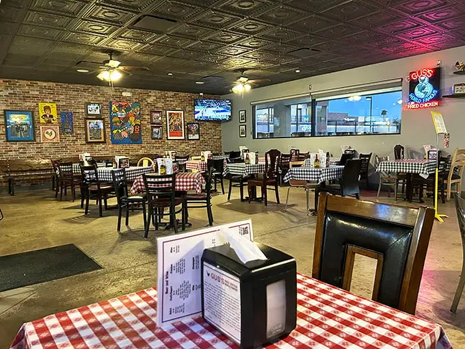 Classic checkered tablecloths and exposed brick walls create the perfect backdrop for chicken-induced euphoria. The tin ceiling adds that touch of vintage charm.