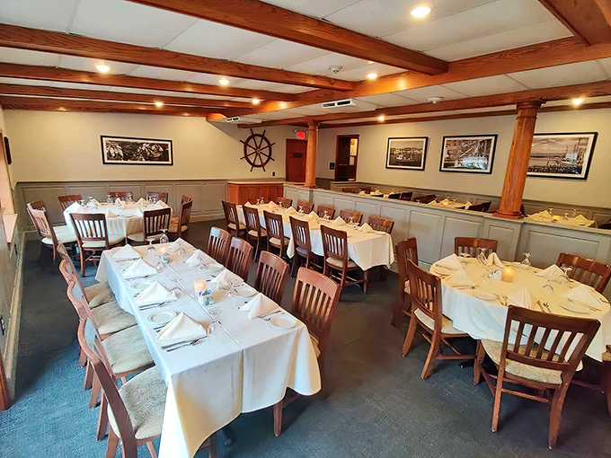White tablecloths and nautical accents create an atmosphere where history and hospitality meet. The ship's wheel says "come aboard" for a memorable meal.