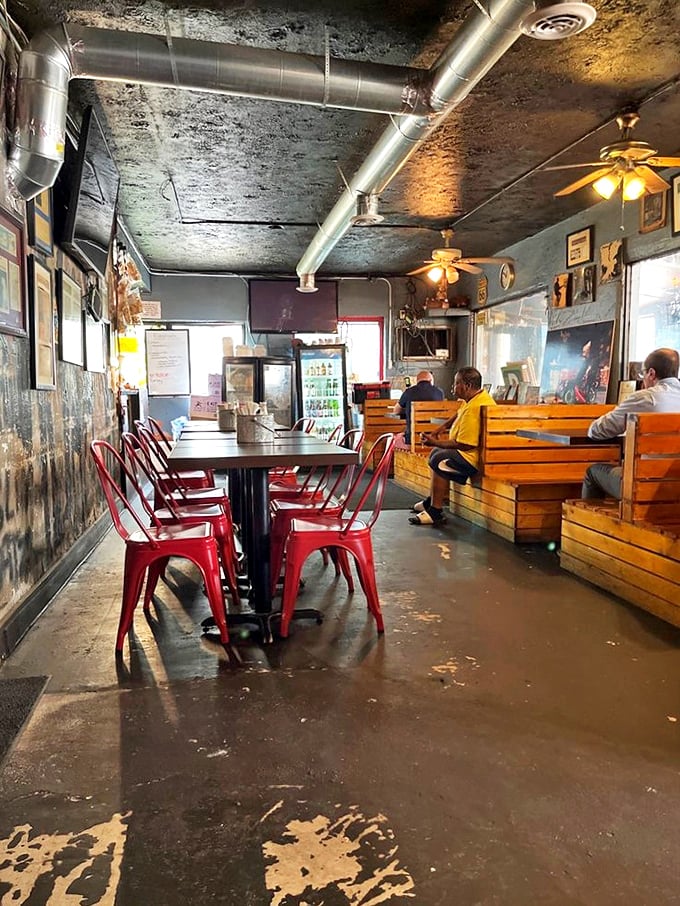 Red metal chairs and wooden benches create the perfect no-frills setting for serious eating. This isn't a place for selfies—it's a place for seconds.