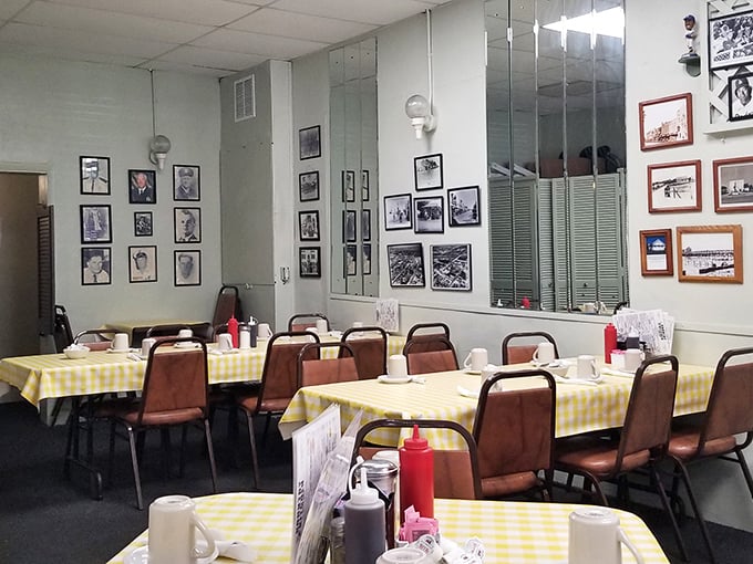 Yellow checkered tablecloths and walls lined with local memorabilia – this isn't interior design, it's a time machine to when conversations mattered more than Instagram.