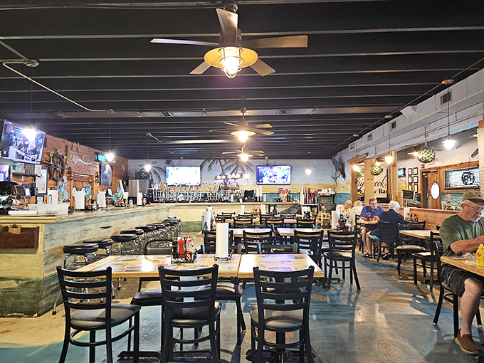 Inside, nautical meets practical with a dining room that feels like the living room of that friend who always has the best seafood stories.