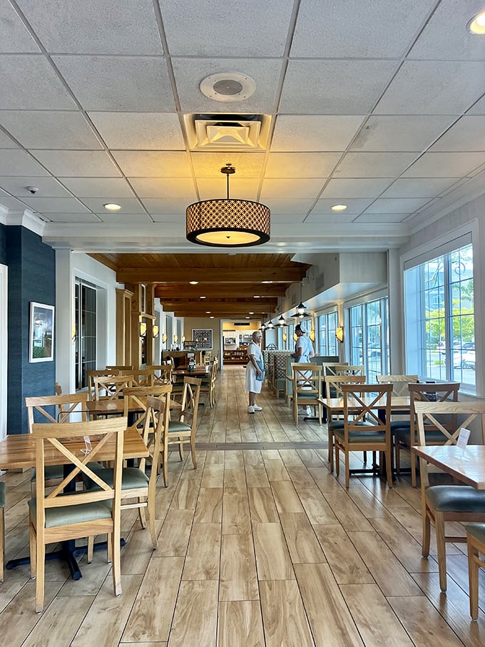 Warm wooden floors and cross-back chairs create an atmosphere that's both spacious and cozy—like dining in a particularly well-designed country home.