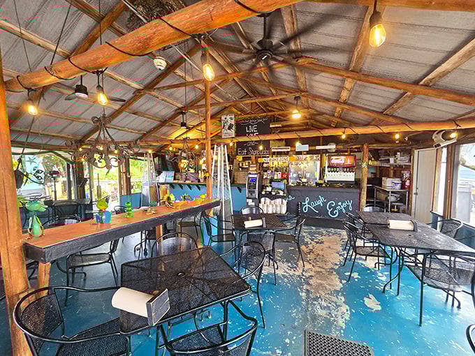 Rustic wooden beams, string lights, and that painted blue floor create the kind of authentic charm money can't buy but memories are made of.