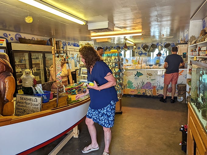 Inside the market, treasures of the sea await. Customers browse fresh catches while nautical decor reminds you this isn't just a restaurant—it's a working fish market.