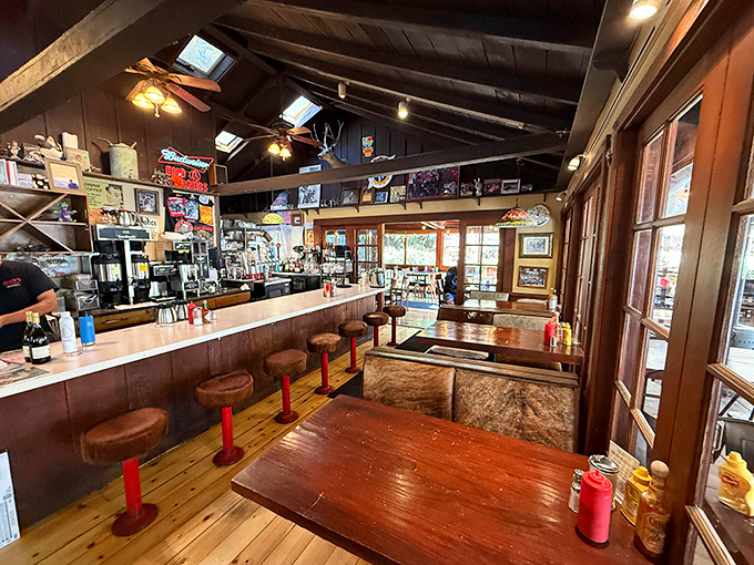 The interior feels like time travel to a simpler era—wooden beams, memorabilia-covered walls, and counter seats perfect for making new friends.