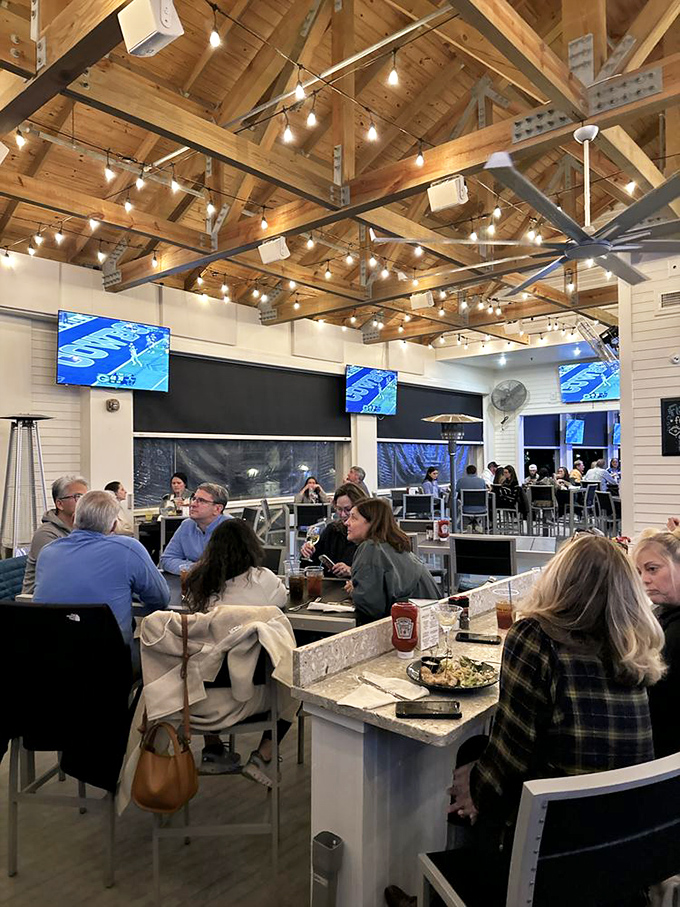 Exposed wooden beams and twinkling string lights create the perfect atmosphere for seafood indulgence. Like dining in a stylish friend's beach house.