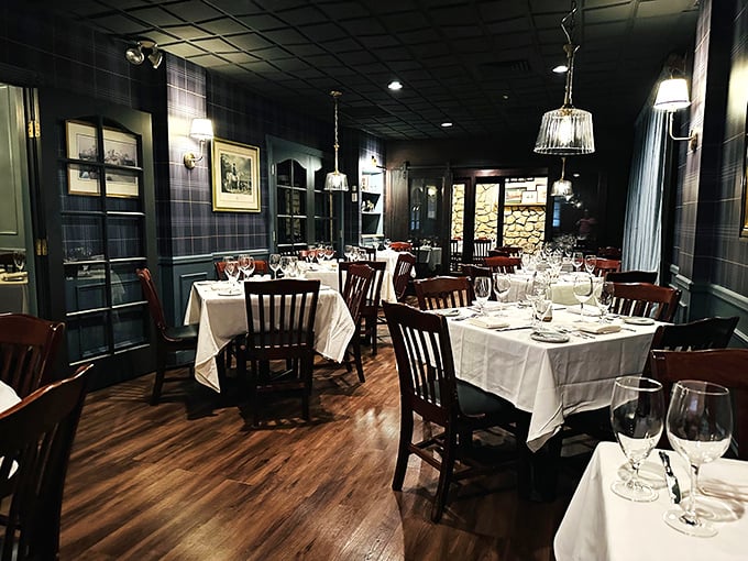Navy walls, warm wood, and white tablecloths create the rare dining room where you can actually hear your dinner companion's stories.