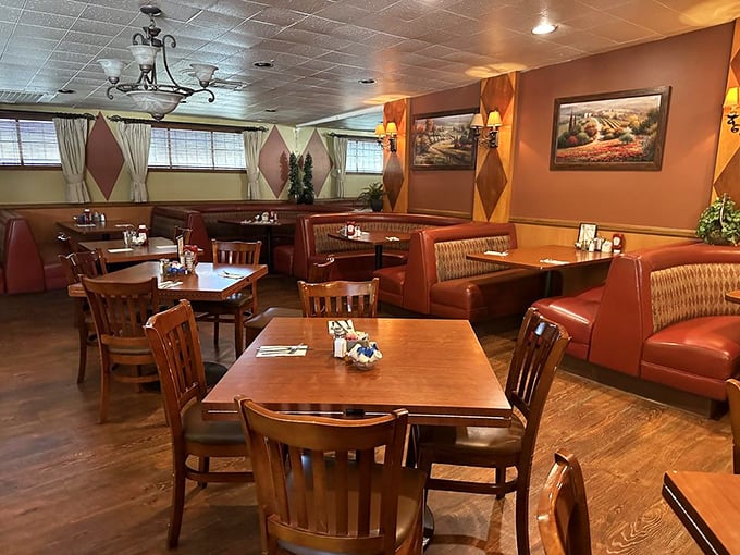Diamond-patterned walls, red vinyl booths, and wooden tables create the perfect time capsule of comfort—this isn't retro by design, it's authentic by persistence.