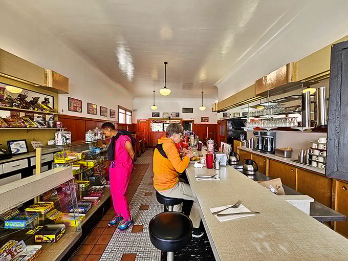 Counter culture at its finest—the classic diner setup invites you to perch on a stool and watch short-order magic happen while candy tempts from glass cases.
