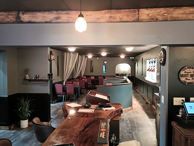 Warm wood tones, exposed beams, and thoughtful lighting create that perfect "welcome home" feeling—if your home happened to serve incredible steaks.