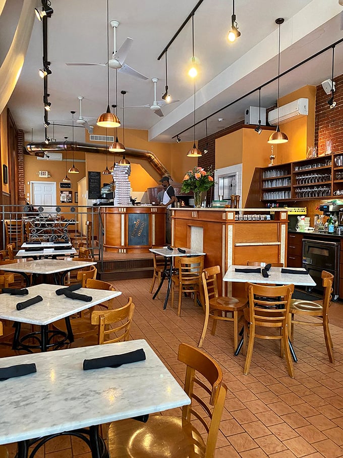 Warm golden walls, marble tabletops, and that inviting wooden bar – this isn't just a restaurant, it's Pittsburgh's living room with better food.