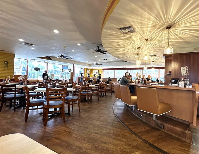 Where breakfast dreams come true. The warm wood tones and curved counter create that perfect diner atmosphere—not too fancy, not too casual, just right for focusing on the food. 