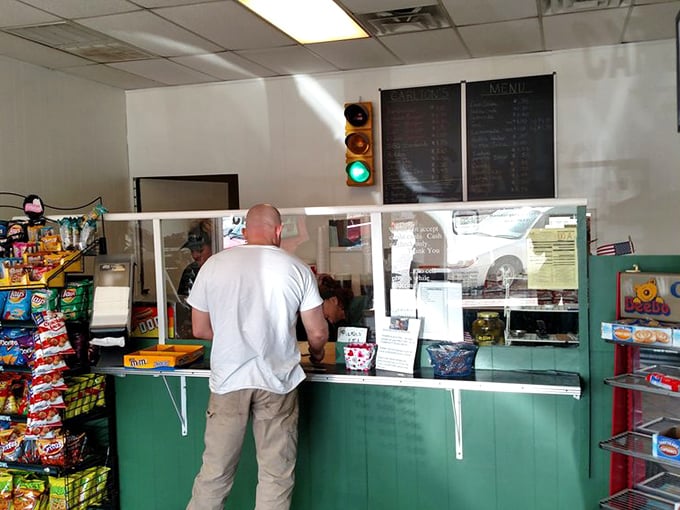 No frills, just thrills. The traffic light on the wall isn't directing traffic—it's giving a permanent green light to burger perfection.