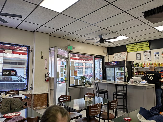 No-frills interior with drop ceiling tiles and simple tables—the universal code for "the food here is going to be spectacular."