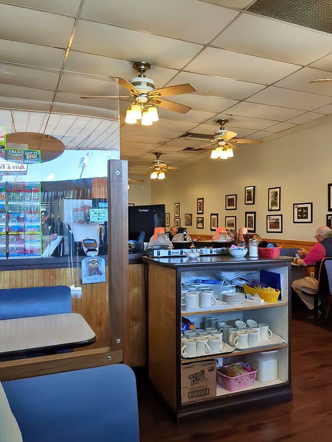 Classic diner ambiance with ceiling fans, wood paneling, and coffee mugs at the ready—exactly as breakfast should be.