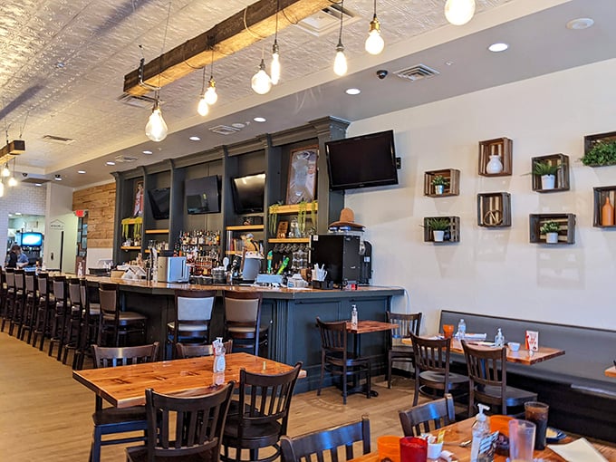Inside, rustic wooden tables meet modern lighting, creating that perfect "come as you are, stay as long as you want" atmosphere.