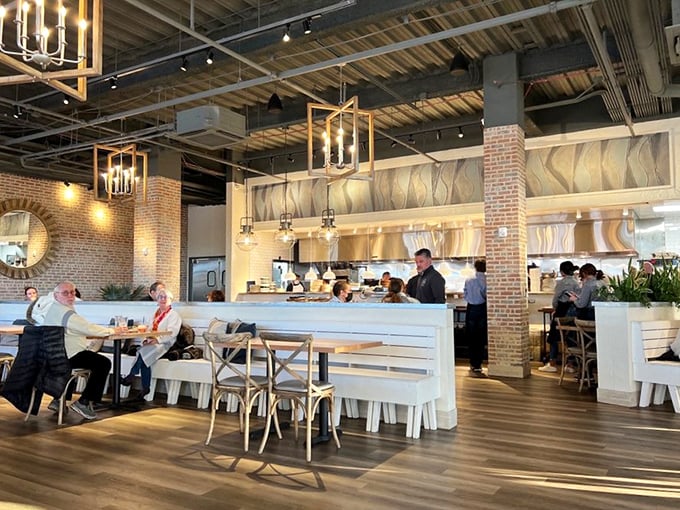 The warm interior blends industrial chic with homey comfort – those pendant lights could make anyone look like they're starring in their own food documentary.
