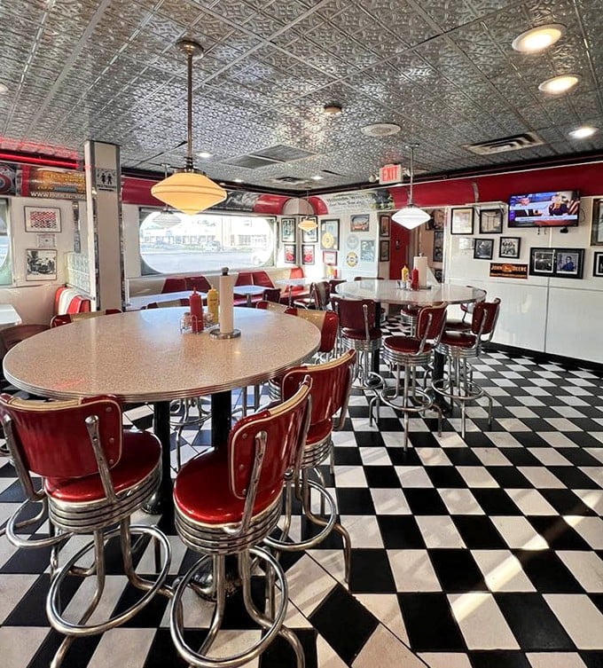 Step into a time machine where the checkerboard floor and cherry-red stools aren't retro—they're authentically vintage, just like the recipes.