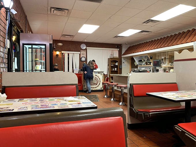 Red vinyl booths and laminate tables—the universal language of "sit down, relax, and prepare for food that hugs your soul."