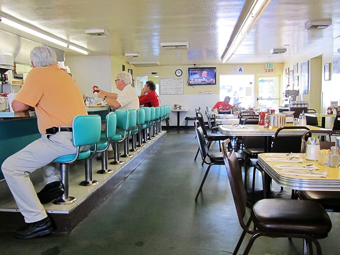 Inside, turquoise counter stools invite you to pull up a seat where conversations flow as freely as the coffee refills.