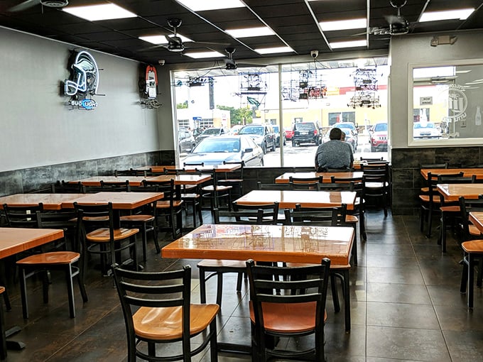 Simple wooden tables and chairs create an unpretentious dining space where the food, not the decor, takes center stage.