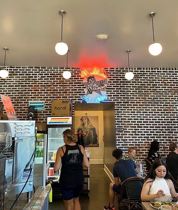 Exposed brick and pendant lights create the kind of ambiance that makes everything taste better—it's science, probably.