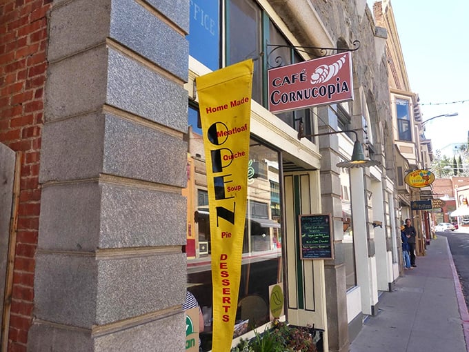 Café Cornucopia's bright yellow banner promises homemade comfort in every bite. Their meatloaf and quiche have achieved local legend status.