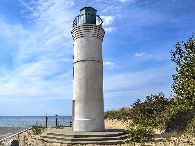 This isn't just a lighthouse—it's Michigan's version of a Hollywood star, posing majestically against that impossibly blue sky. Guiding ships and Instagram feeds alike.