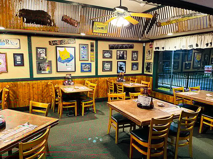 The interior showcases classic cabin-style décor with wooden paneling, bear carvings, and nostalgic memorabilia that transport you to simpler times.