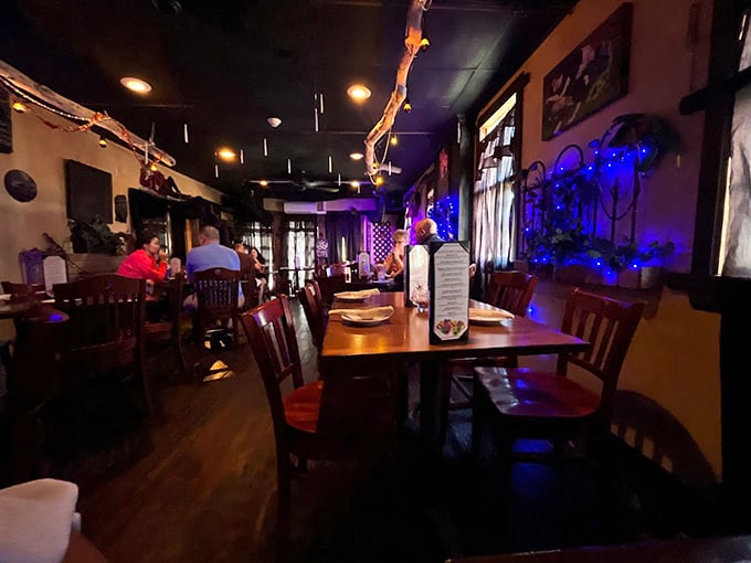 Step inside and the blue-lit ambiance transports you straight to New Orleans. This isn't just dinner—it's a mini vacation without the TSA pat-down.