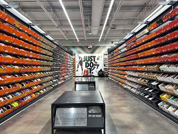 Nike's sneaker wall is the Sistine Chapel of footwear—a color-coordinated monument to human achievement where even non-runners contemplate taking up jogging.