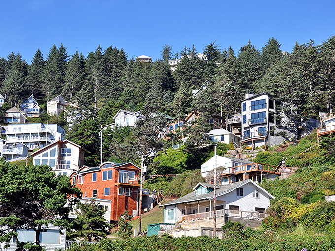 A colorful patchwork of homes clings to the hillside, each one angling for the best seat to nature's greatest show—the Pacific sunset.