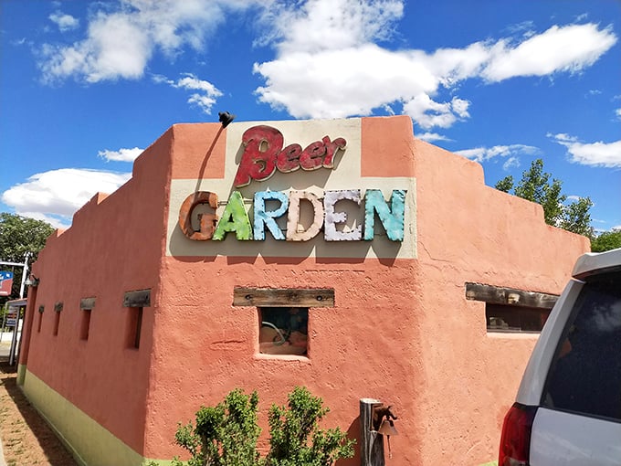 The Beer Garden at Planet Marfa—where desert thirst meets laid-back vibes in a salmon-colored adobe sanctuary.