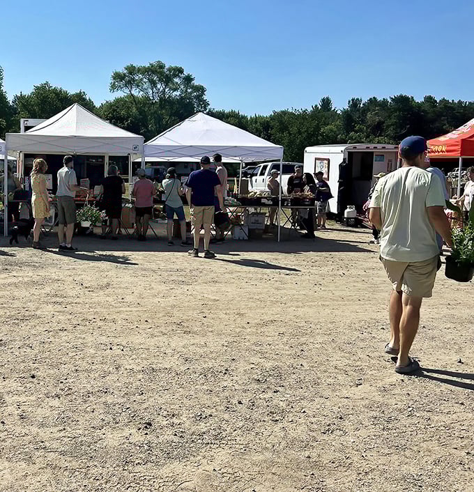 Weekend warriors on the hunt! Like archaeologists of everyday Americana, these shoppers know the early bird catches the vintage vinyl and hand-crocheted pot holders.
