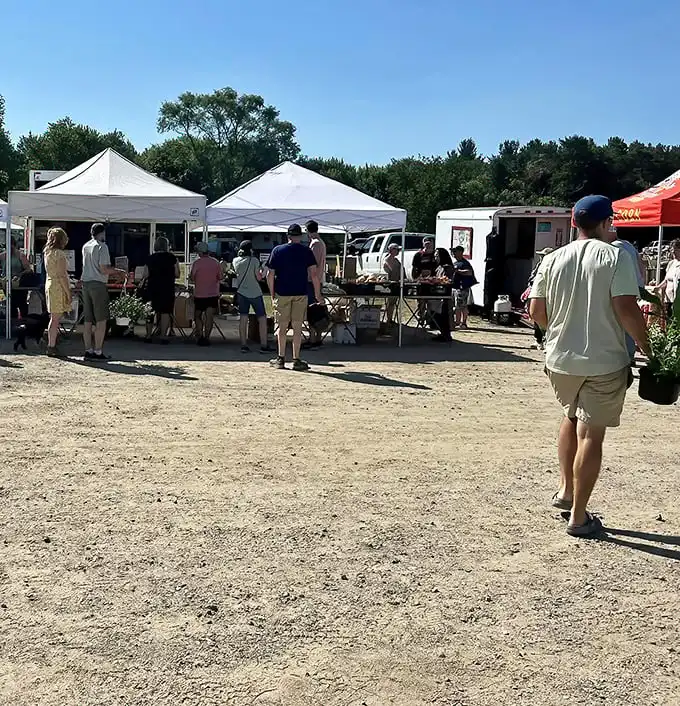 Weekend warriors on the hunt! Like archaeologists of everyday Americana, these shoppers know the early bird catches the vintage vinyl and hand-crocheted pot holders.