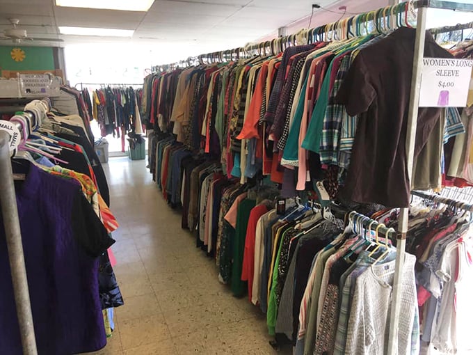 Rows of colorful clothing create a rainbow of possibilities where yesterday's fashion becomes tomorrow's perfect find.