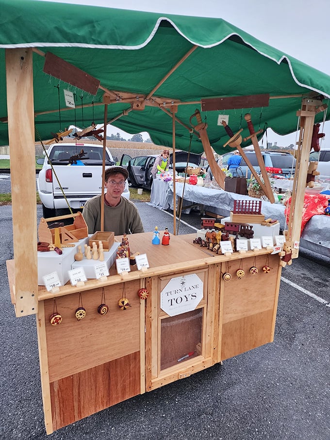 Handcrafted wooden toys await new homes at this outdoor stall. No batteries required – just imagination and the smooth feel of well-sanded maple.
