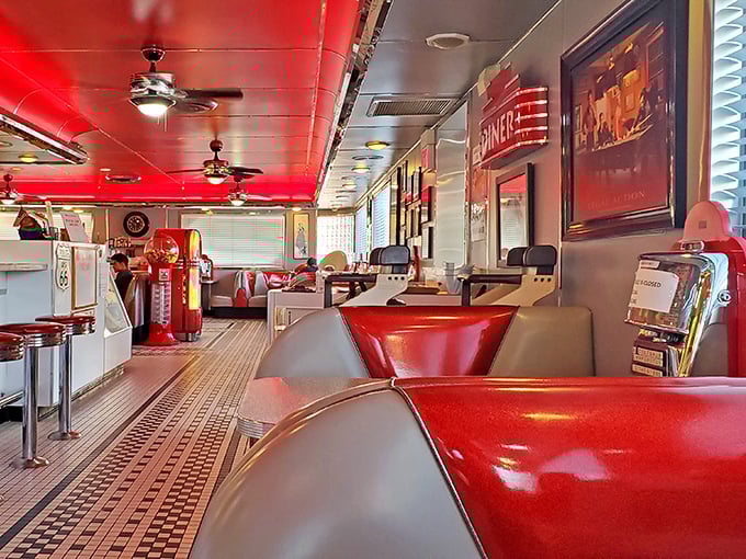 Red vinyl booths and checkered floors aren't just design choices—they're portals to an era when conversations happened face-to-face and calories didn't count.