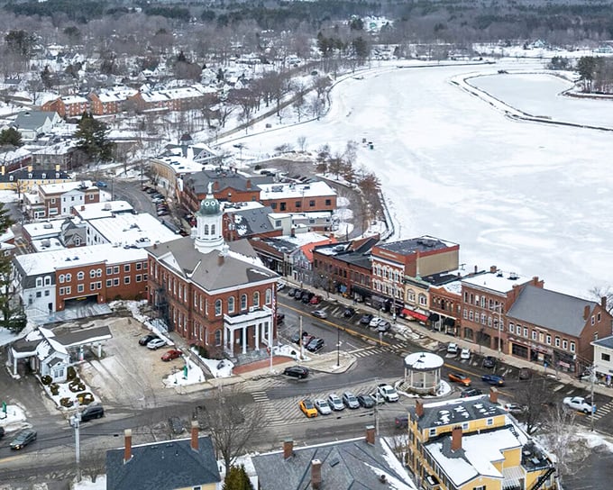 Winter transforms Exeter into a snow globe scene straight out of a Norman Rockwell painting, with the historic town hall anchoring this quintessential New England vista.