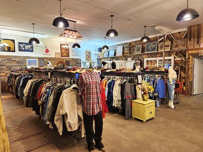 Clothing racks stretch like a textile rainbow against rustic wood walls. The thoughtfully organized apparel section makes finding your next favorite outfit actually enjoyable.
