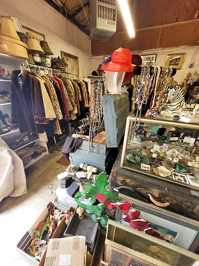 A clothing vendor's paradise where vintage fur coats and costume jewelry await their second act. That red hat is practically begging for a tea party!