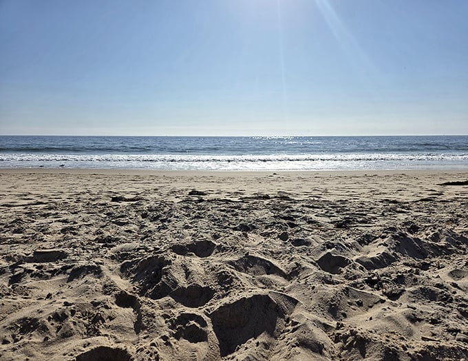 Footprints that disappear with the tide – nature's way of saying "no evidence, no problem." The perfect sandy canvas for temporary art.