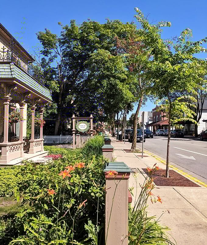 Flower gardens frame the sidewalks like nature's welcome mat, offering a glimpse of Midwestern hospitality before you even meet the locals.