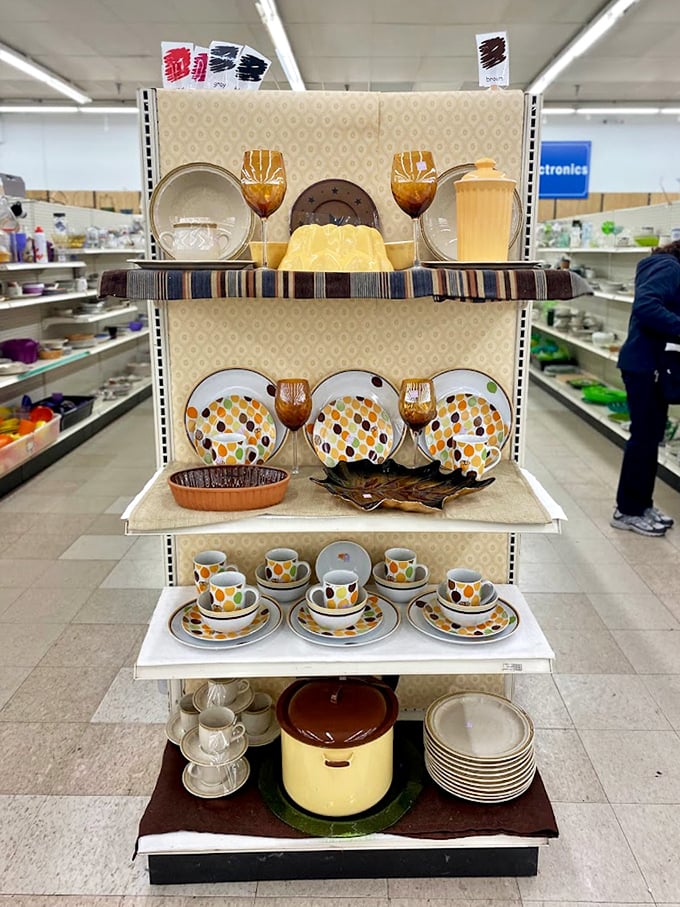 Mid-century modern meets retro chic in this carefully curated dishware display. Someone's grandmother's pride and joy awaits its second chapter.