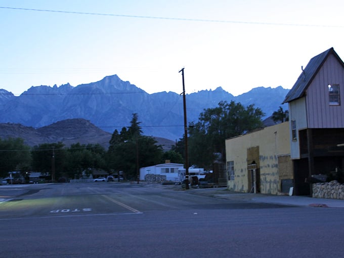 The Sierra Nevada mountains loom like ancient guardians over Lone Pine's quiet streets. Small town, big views.