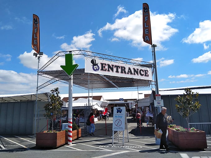 Follow the green arrow to retail therapy. This entrance isn't just a gateway—it's a portal to a parallel universe where haggling is an Olympic sport.